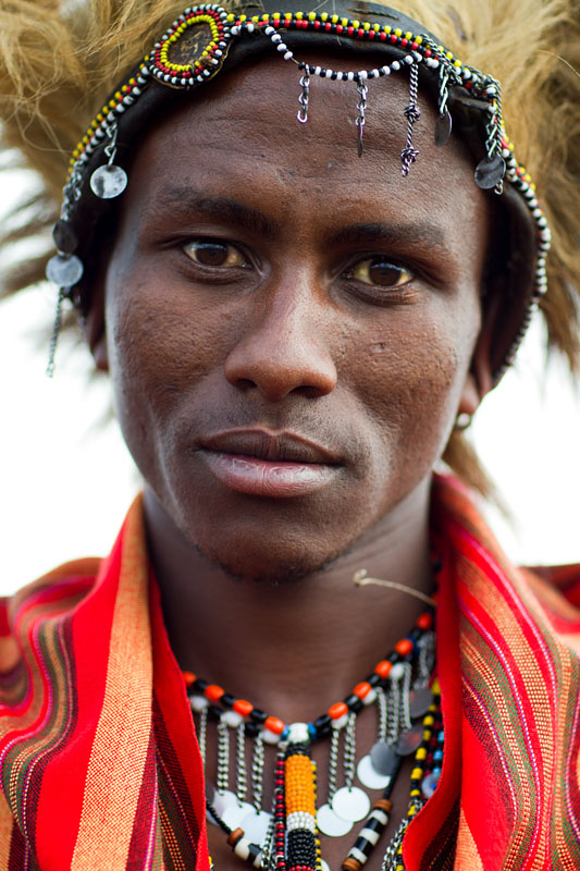 Masai warrior with lion head Masaai Mara Kenya